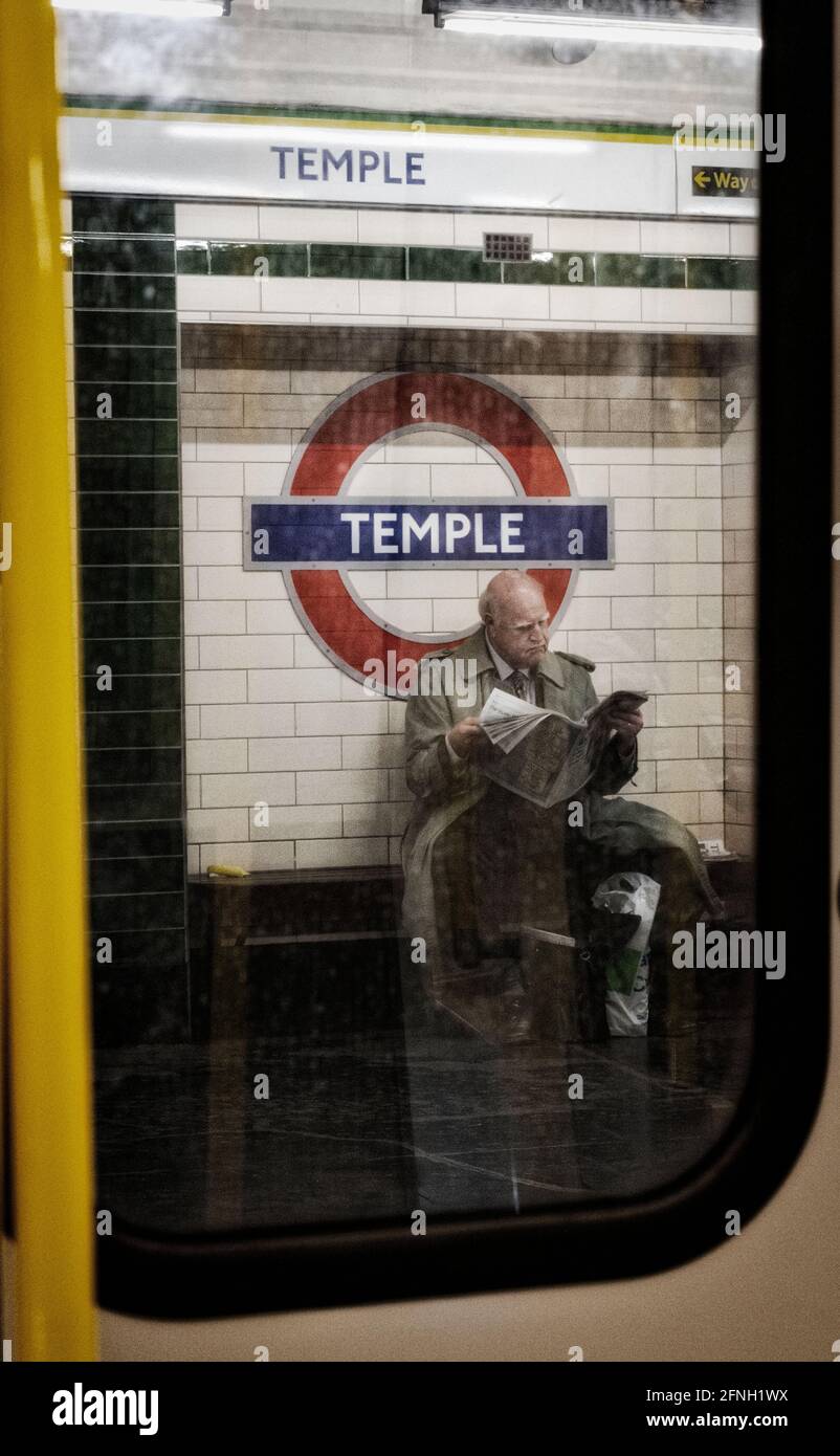 Reading Newspaper On Subway High Resolution Stock Photography and ...