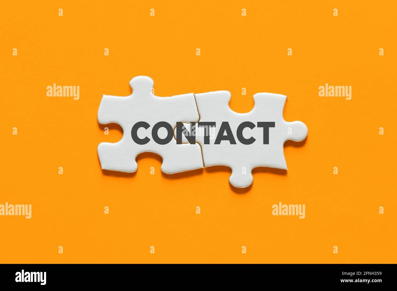 Connected puzzle pieces with the word contact. Communication ...