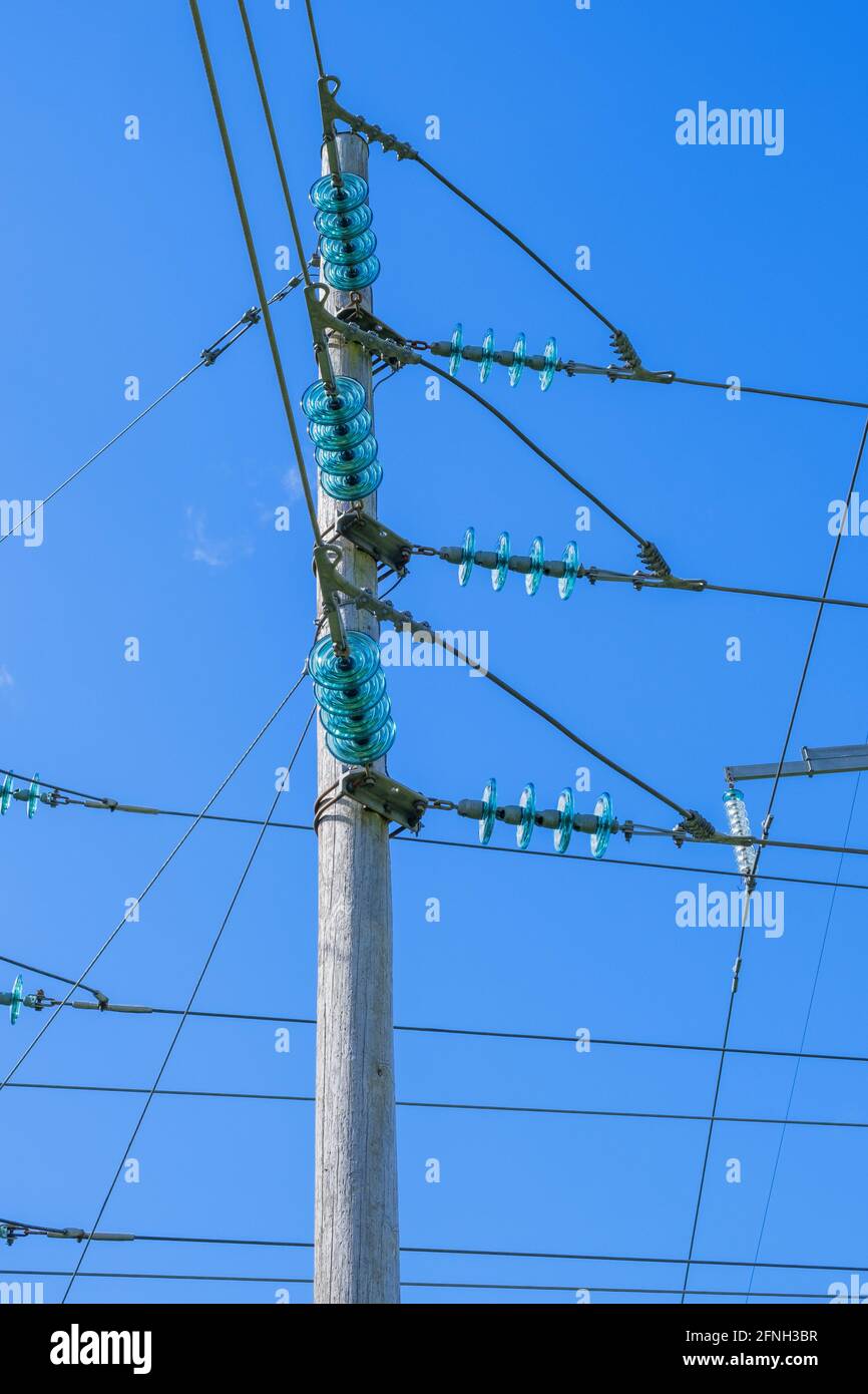 Power line pole with insulators Stock Photo - Alamy