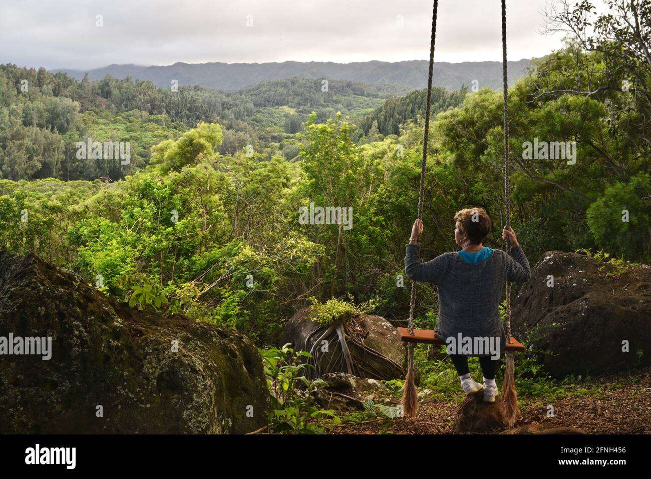 Woman swinging rope hi-res stock photography and images - Alamy