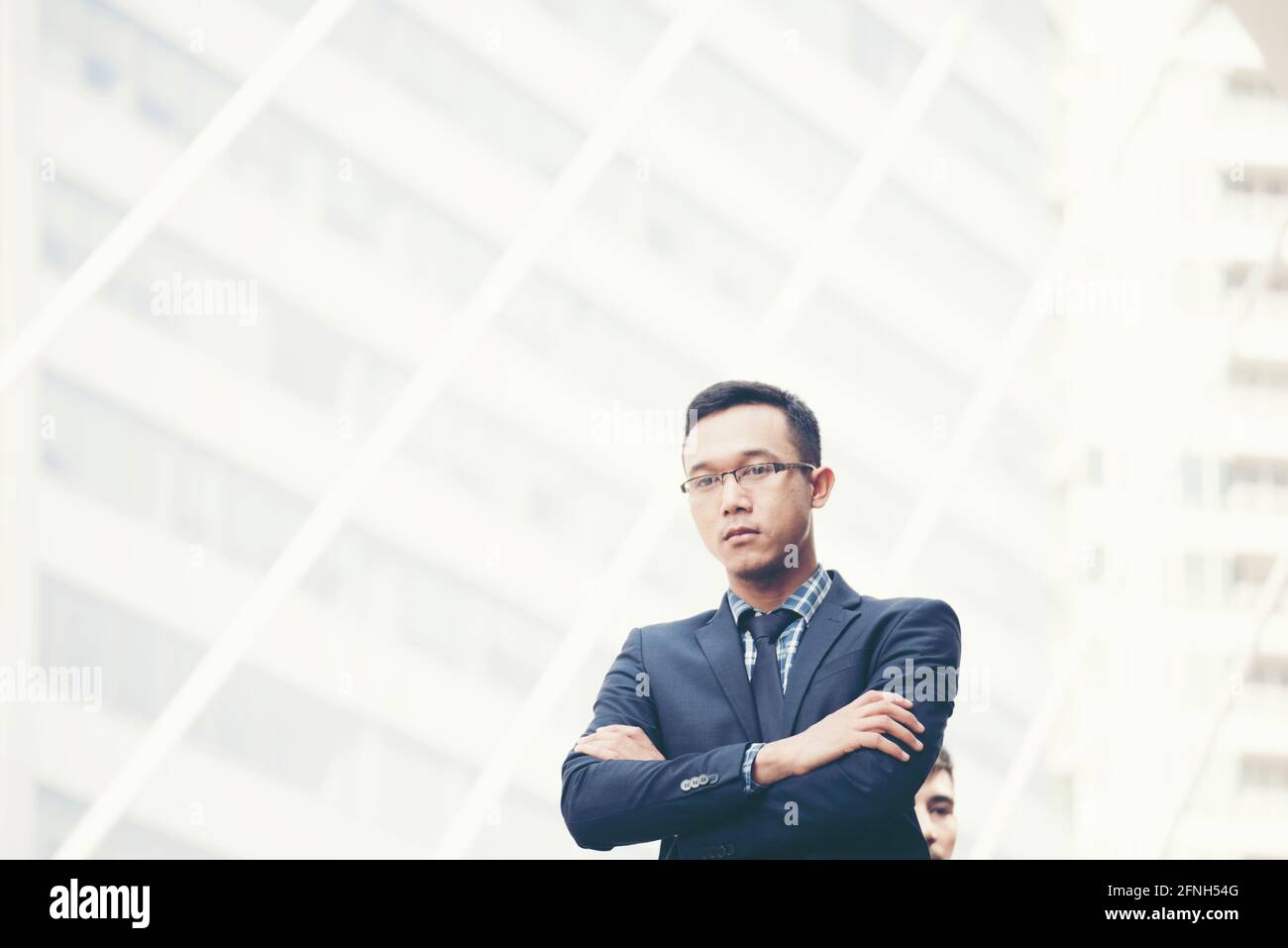 Leader young executive businessman standing in modern city background ...