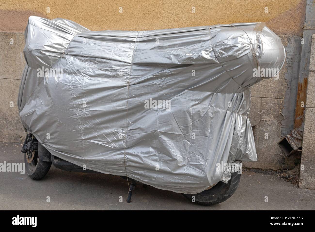 Packed Motorcycle Under Silver Tarp Cover Winter Storage Stock Photo ...
