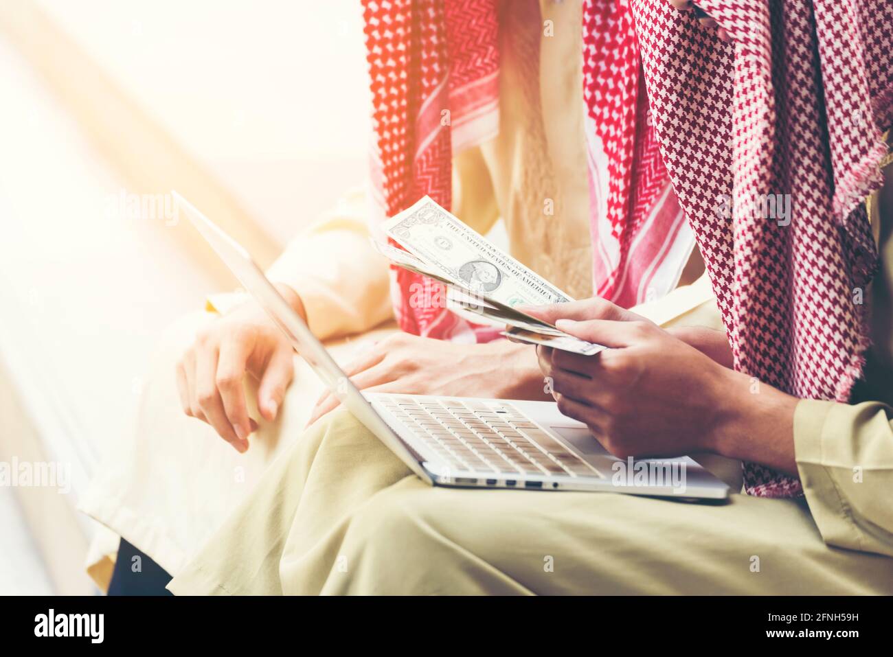 Handsome greedy arab man showing money on hands and counting money ...