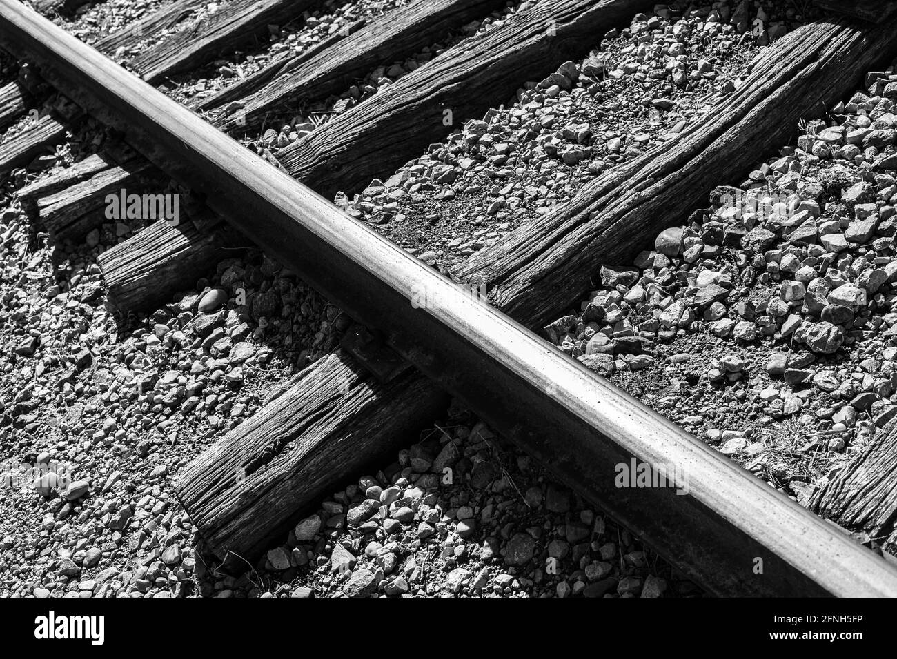 Grayscale closeup shot of train tracks in Rivas-Vaciamadrid, Spain ...
