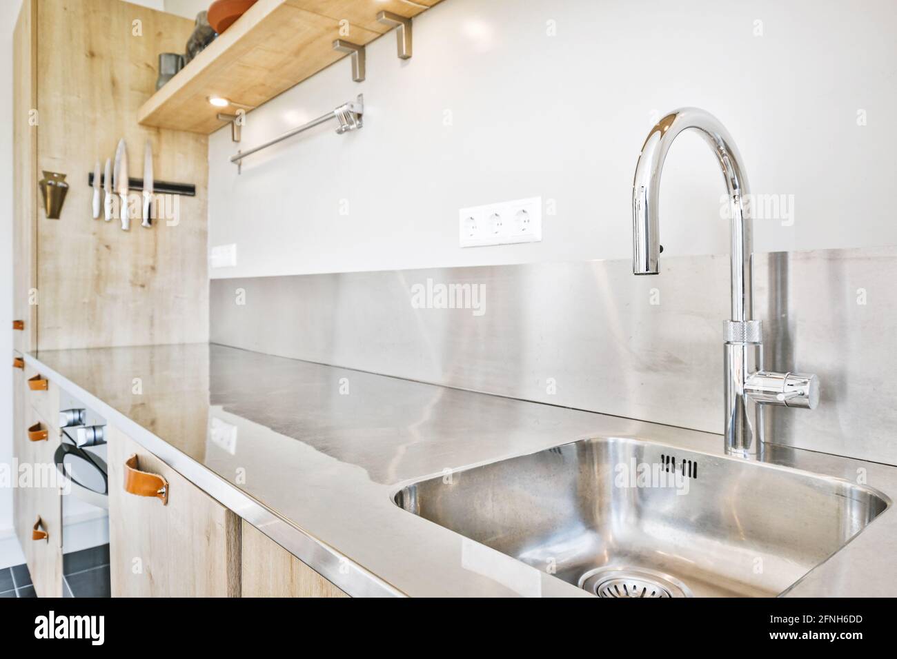 Modern washbasin under counter in kitchen Stock Photo - Alamy