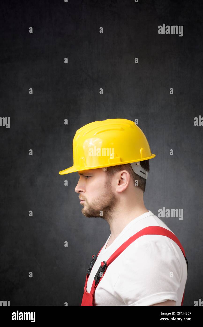 Sad construction worker Stock Photo - Alamy