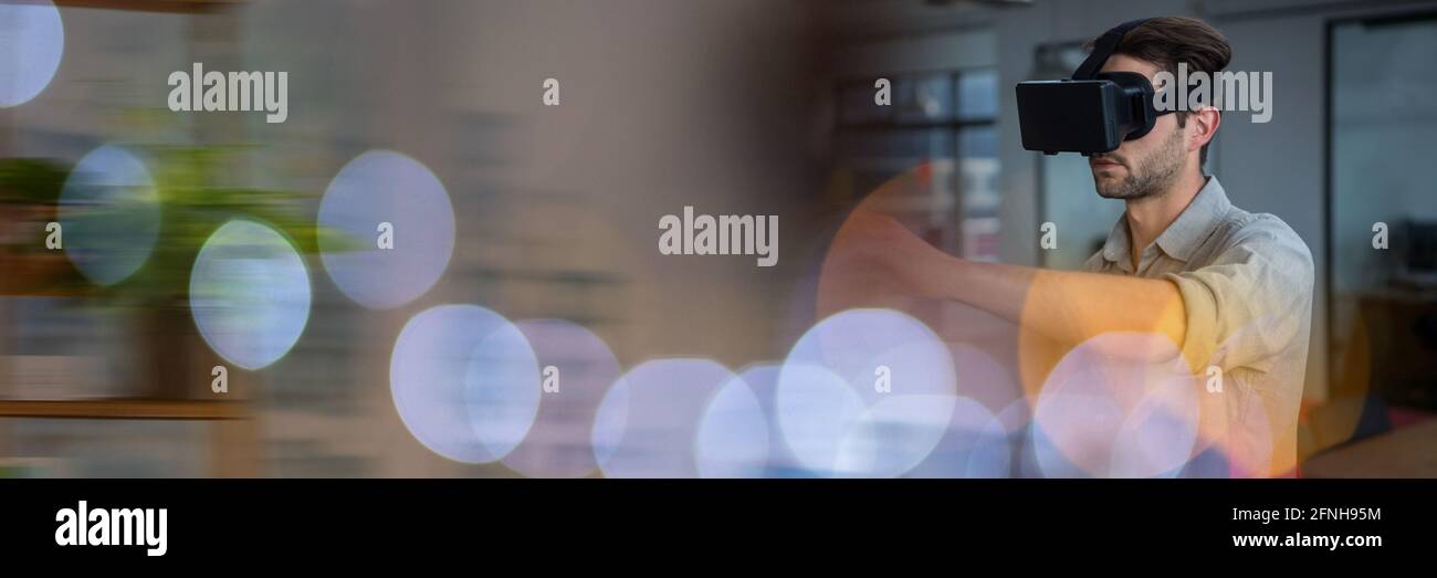 Blue sparkling transition over a man using vr headset, virtual reality ...