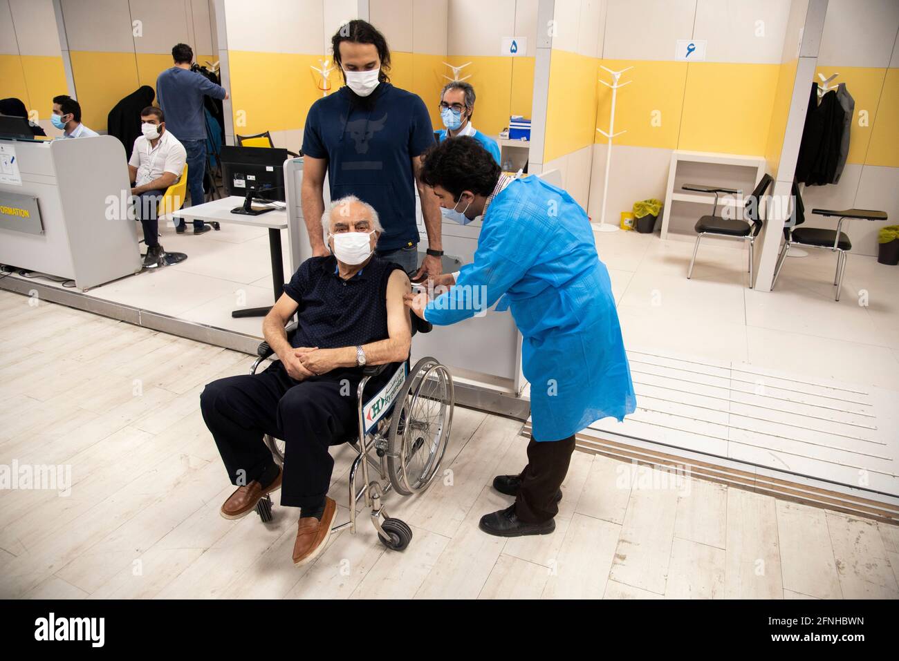 Tehran, Iran. 17th May, 2021. An Iranian elderly man wearing a ...