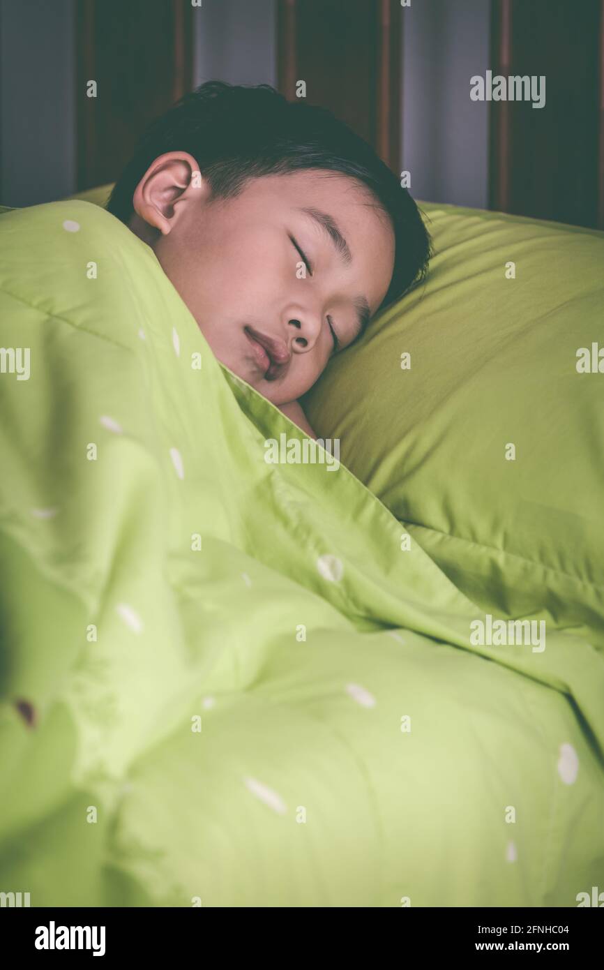 Healthy children concept. Closeup of asian child sleeping peacefully ...