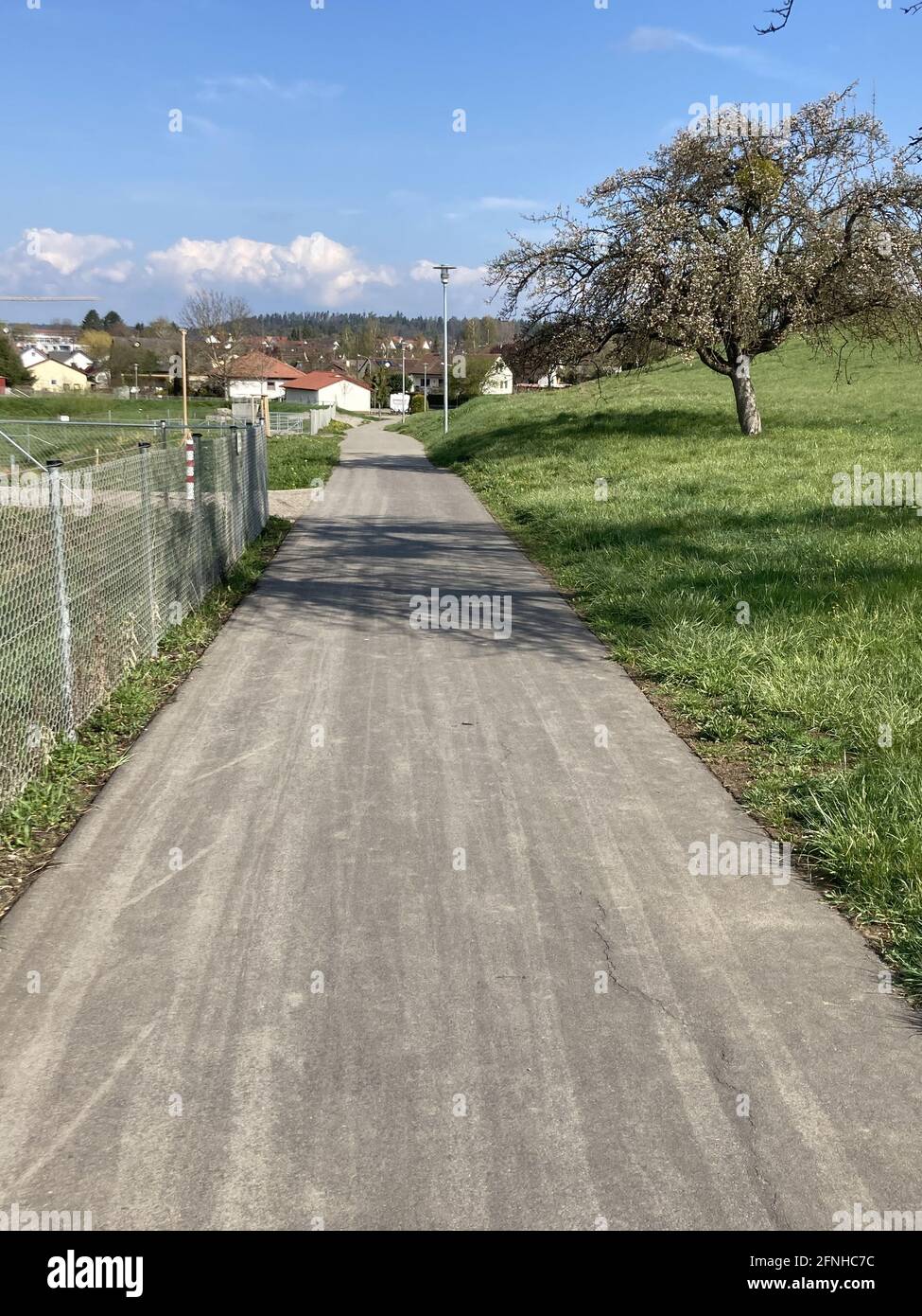Empty road through a small village Stock Photo - Alamy