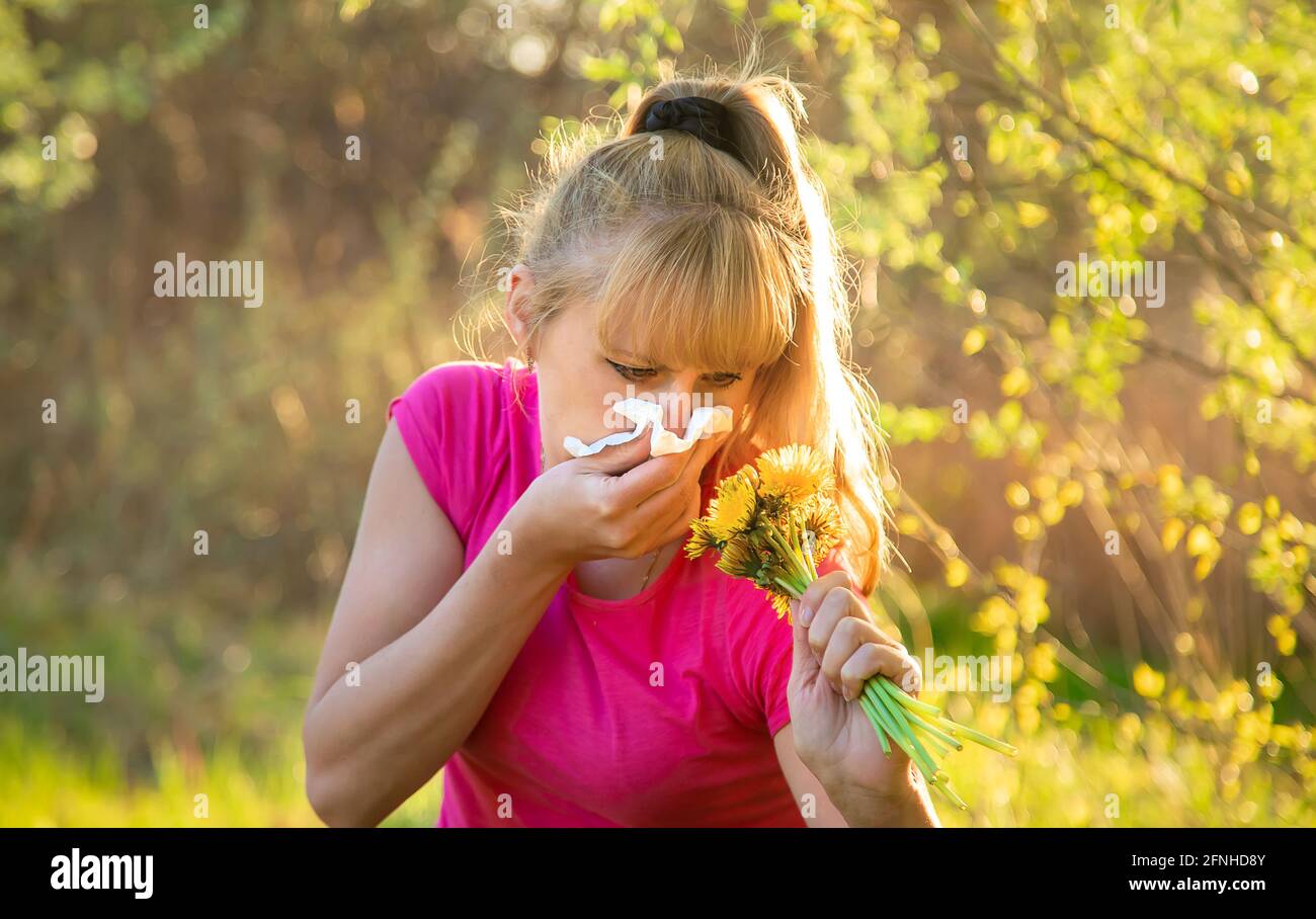 The woman is allergic to flowers. Selective focus. nature Stock Photo ...