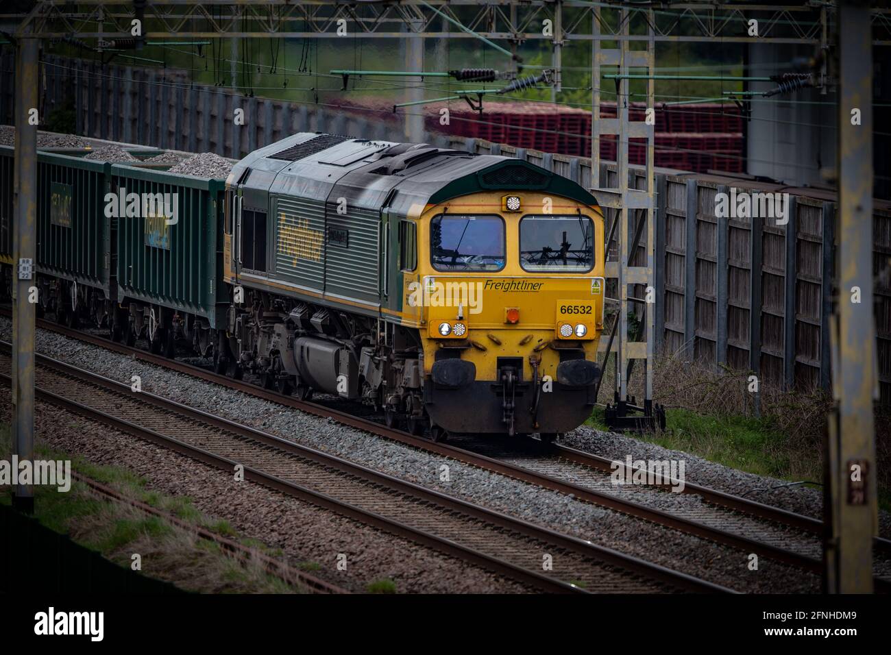Freightliner Class 66 with load passes DIRFT Stock Photo - Alamy