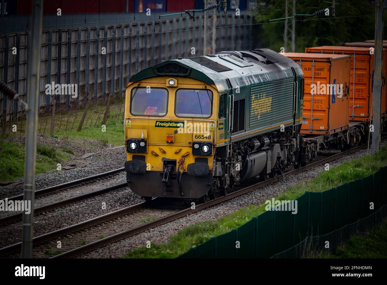 Freightliner Class 66 with load passes DIRFT Stock Photo - Alamy