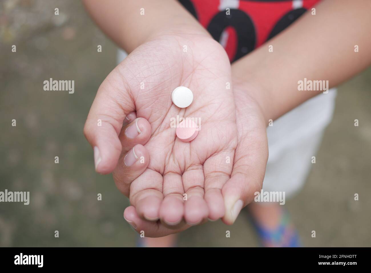 Child taking pills hi-res stock photography and images - Alamy