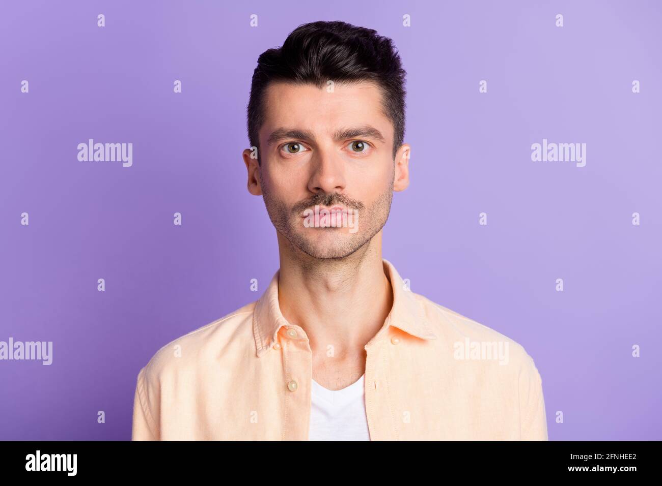 Photo of calm serious guy with mustachio look camera wear beige shirt ...