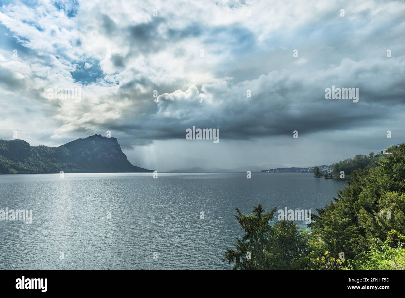 Storm over the Alps mountains and lake Lucerne. Storm clouds, rain ...
