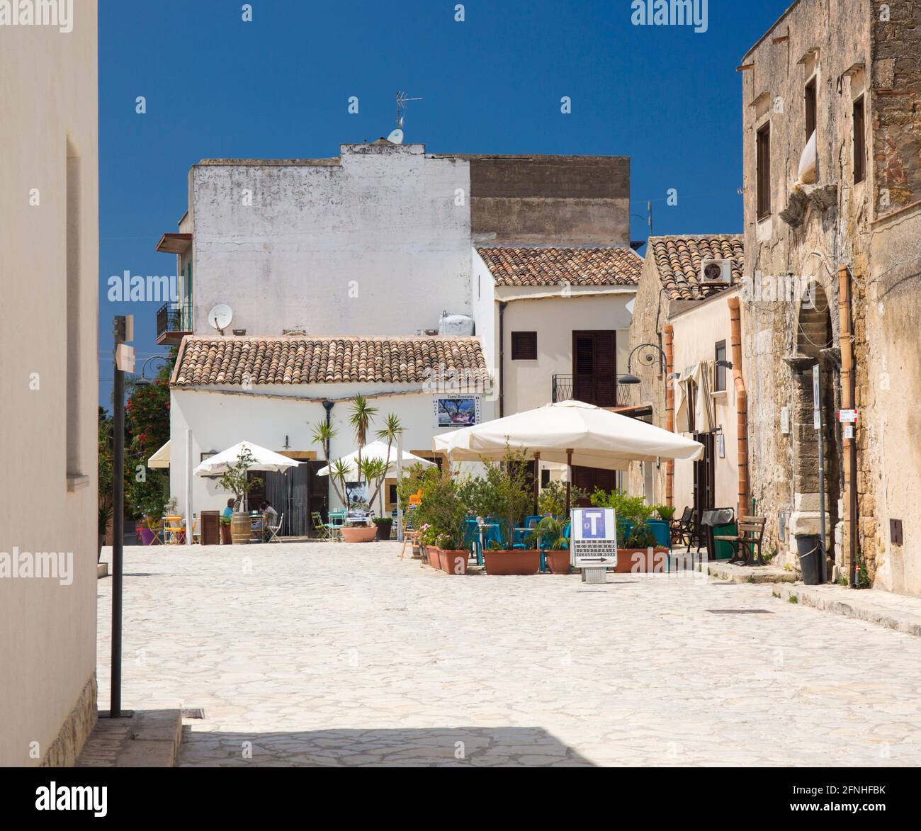 Scopello, Trapani, Sicily, Italy. Quiet pavement cafes in a sunlit ...