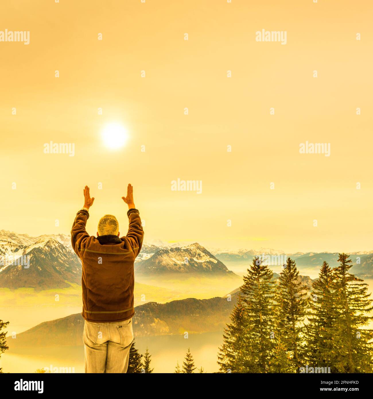 Reach the sun. An elderly man. Open arms joyful gesture. Mountain ...