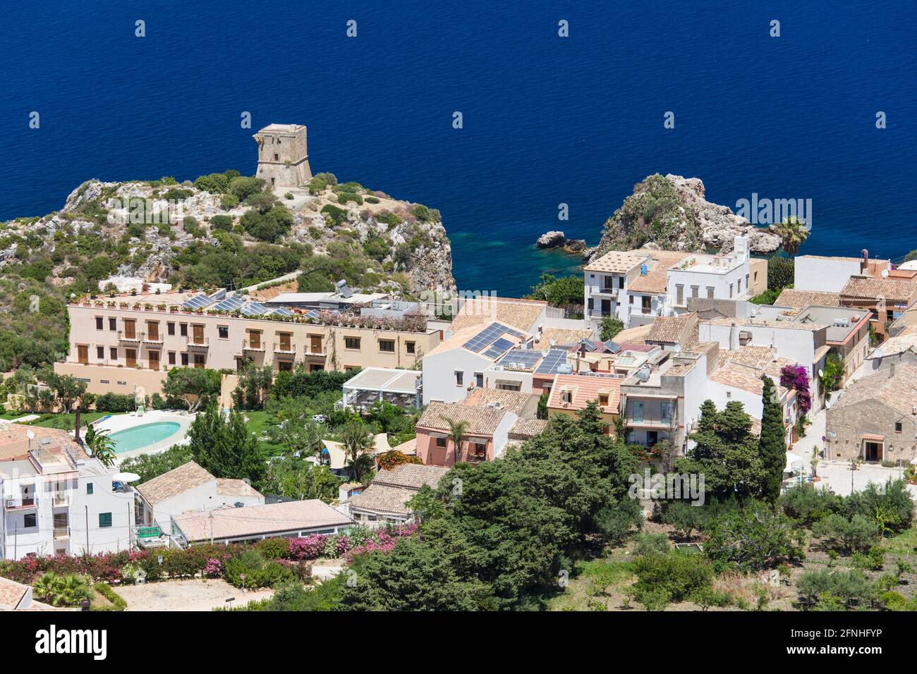 Scopello, Trapani, Sicily, Italy. View over village rooftops to ancient ...