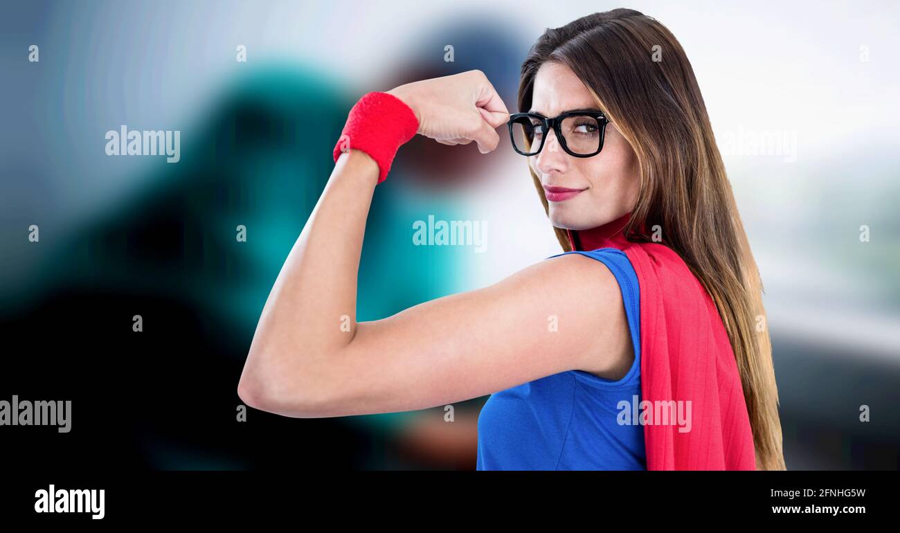 Composition of woman in glasses dressed as superhero flexing muscles on ...