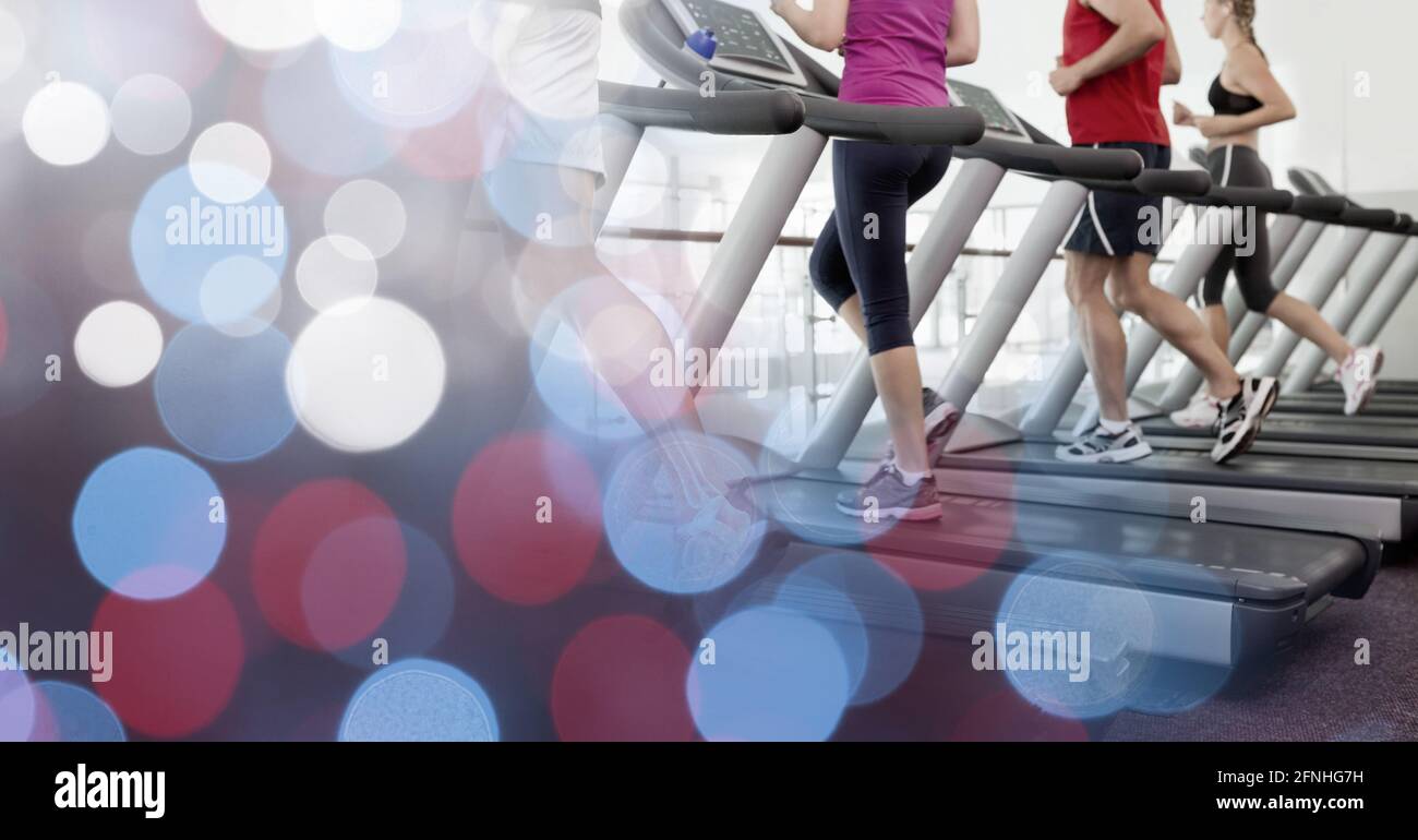 Composition of people running on treadmill spots of light. exercise and ...