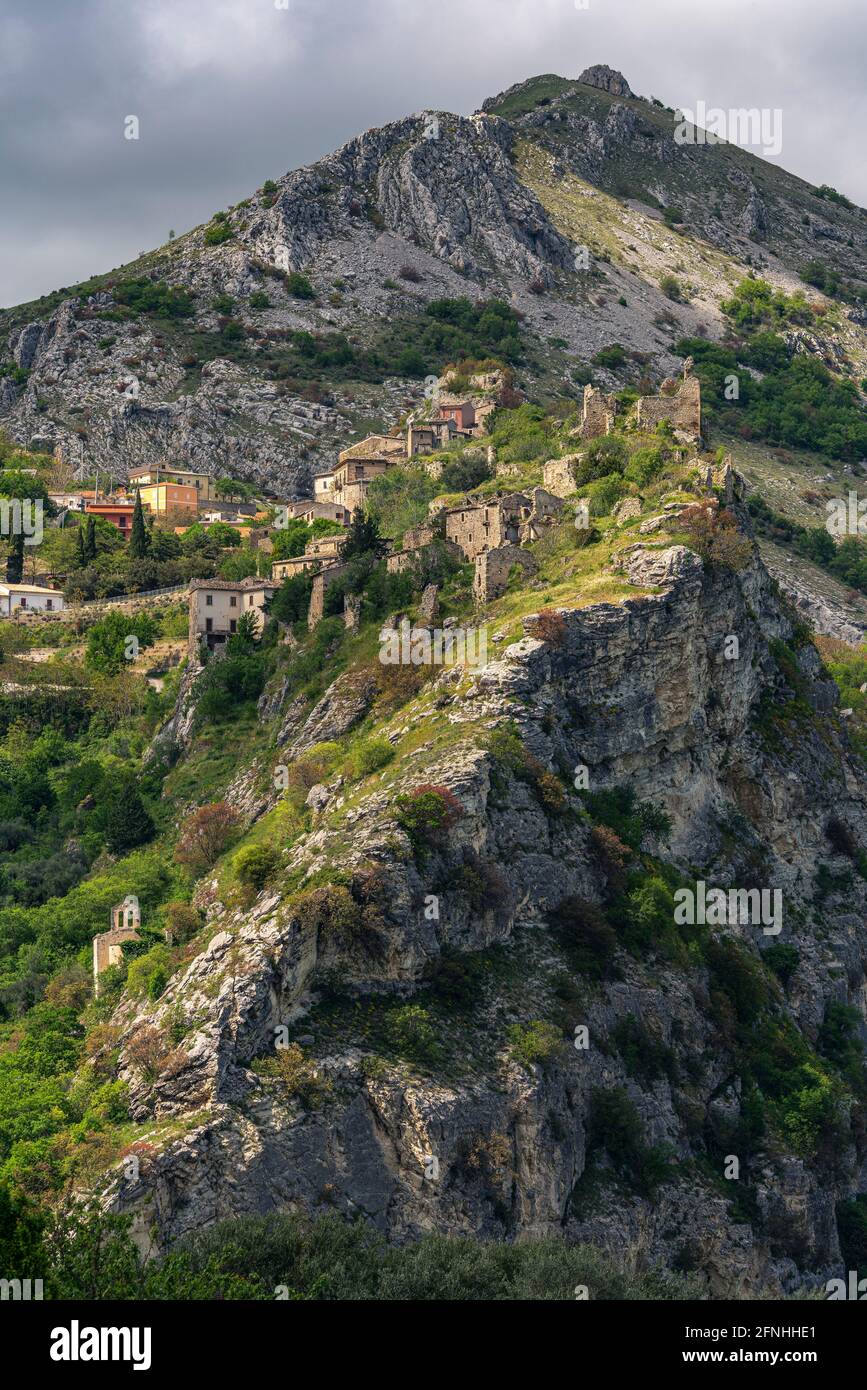 Ancient medieval village perched on an overhanging rock. Play of light ...