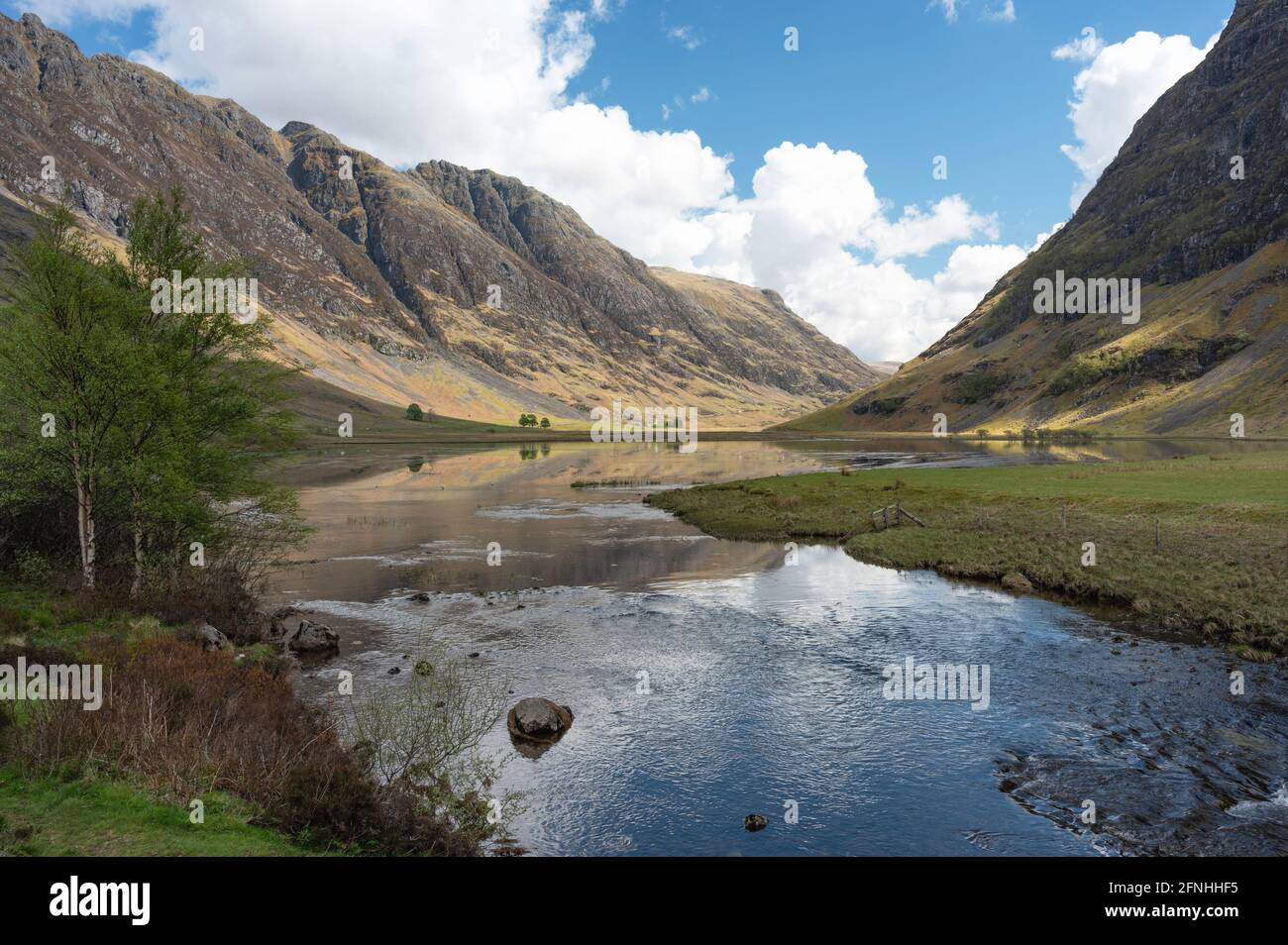 Landscape of Glencoe in Scottish Highlands with reflections in water of ...