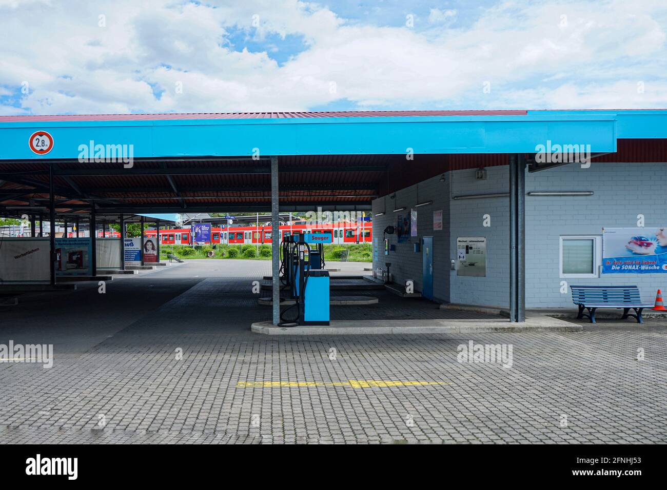 Car washing station, colorfully designed in blue with red lettering ...