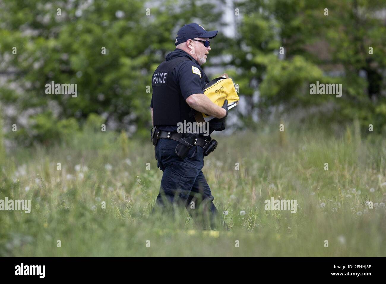 Chicago police officers work at the scene where two officers were shot ...