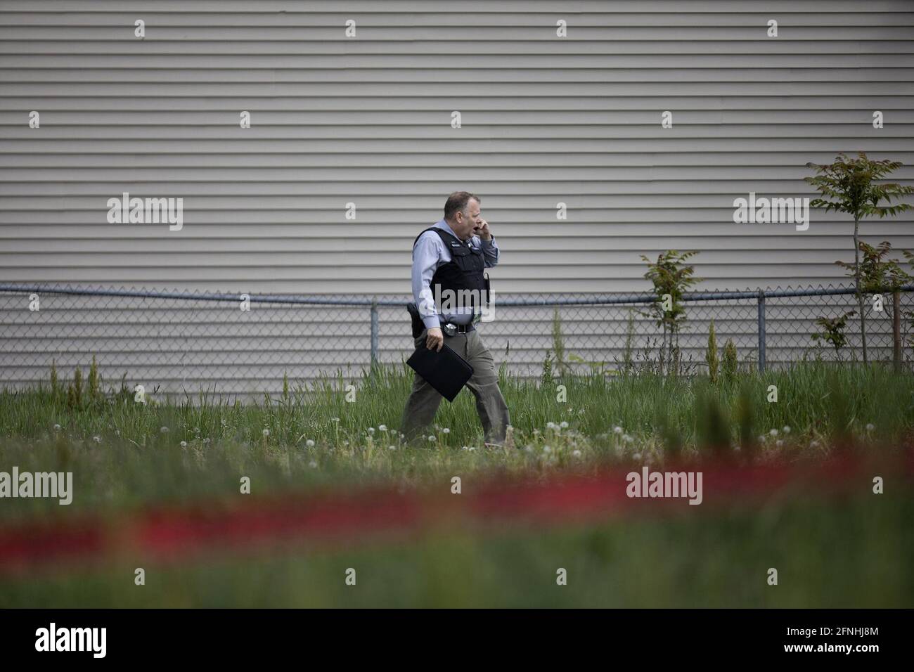 Chicago police officers work at the scene where two officers were shot ...