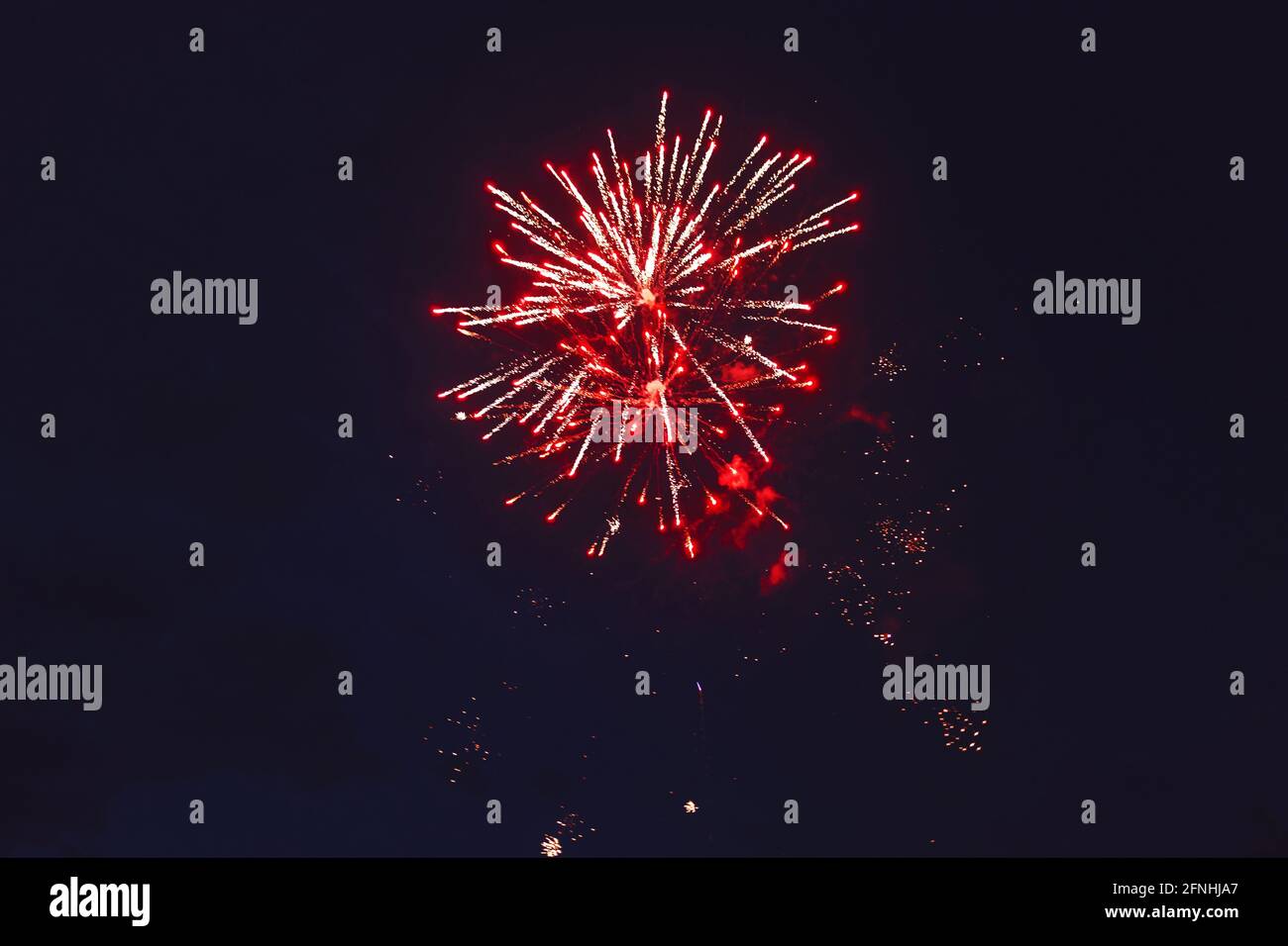 Brightly colorful fireworks and salute in the night sky Stock Photo - Alamy