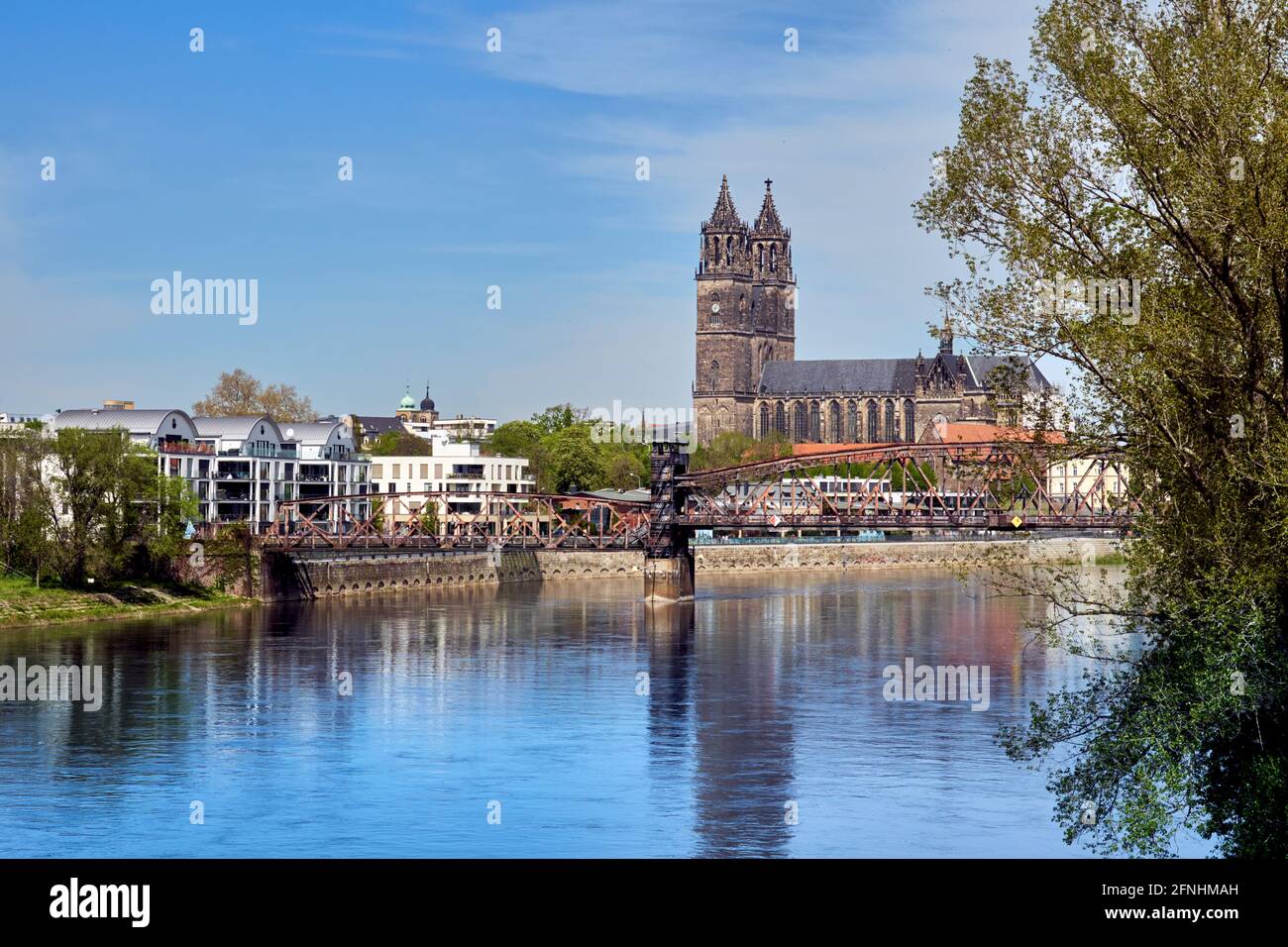 View over the river Elbe to an old iron railroad bridge and the ...