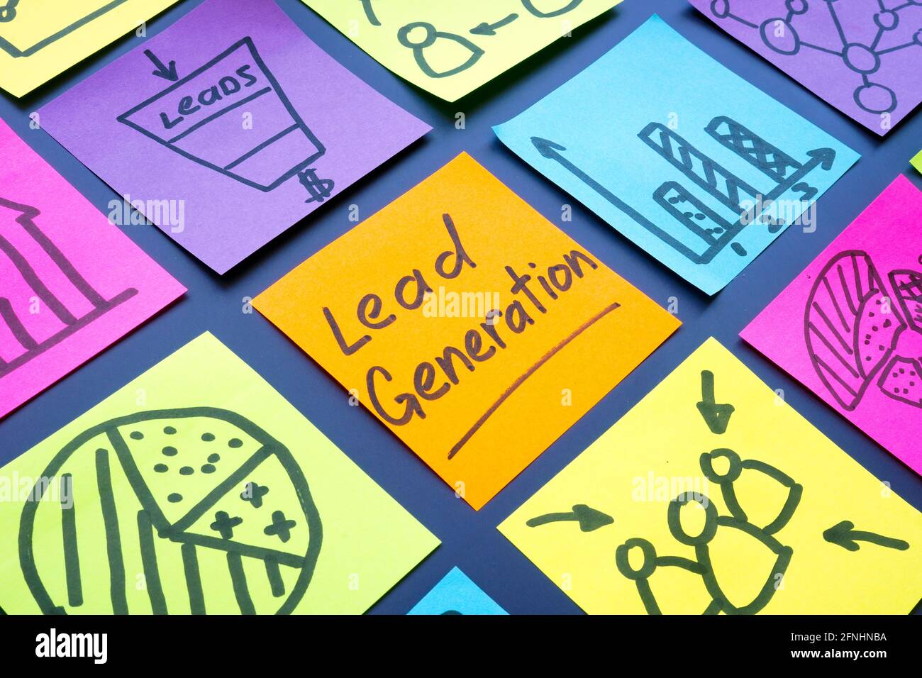 Lead generation and memo sticks with charts and graphs Stock Photo - Alamy