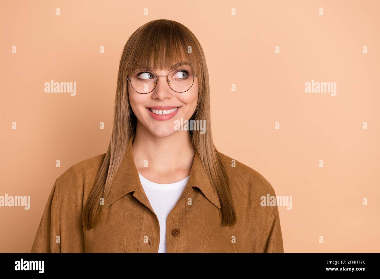 Photo of dreamy happy young lady look empty space imagine idea wonder ...
