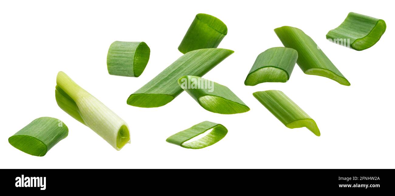 Falling green onion slices, cut chives isolated on white background ...