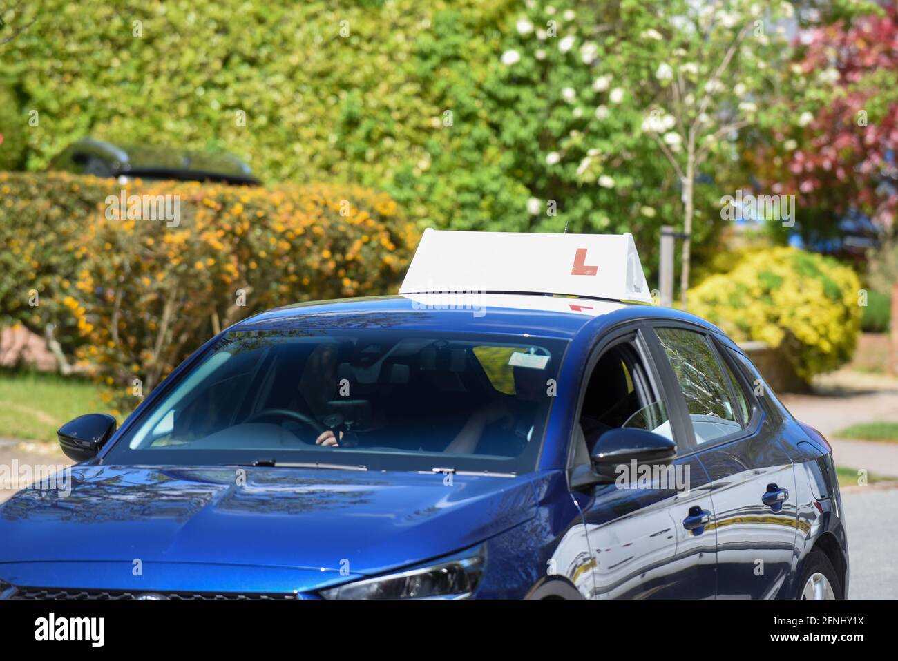 Learner driving having driving lesson to learn to drive on public roads ...