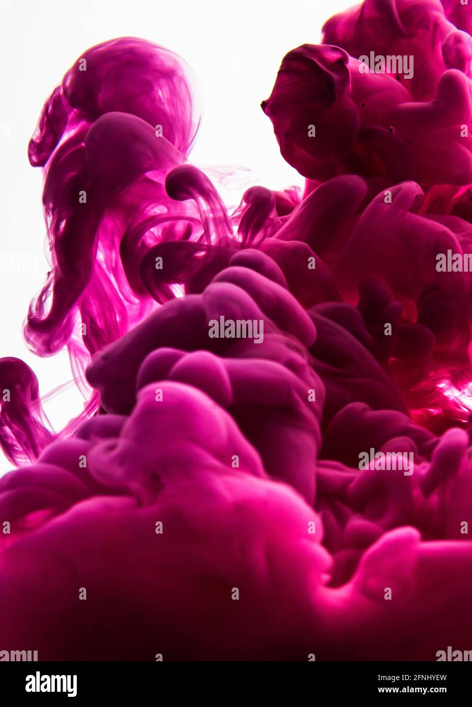 Ink drop in water. Abstract background. Pink background Stock Photo - Alamy