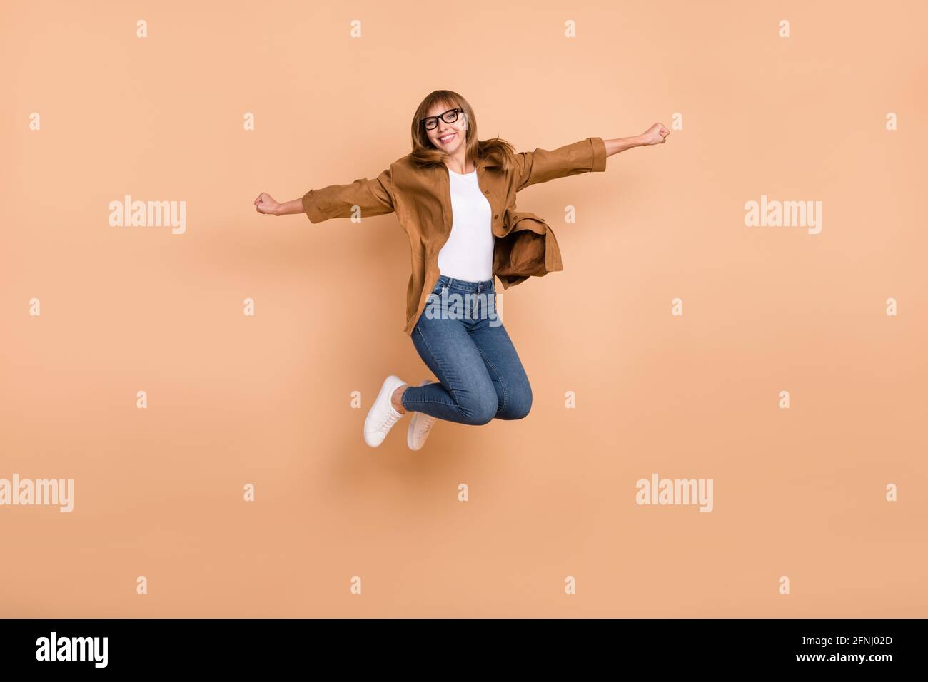 Full body photo of happy nice woman jump up air good mood smile ...