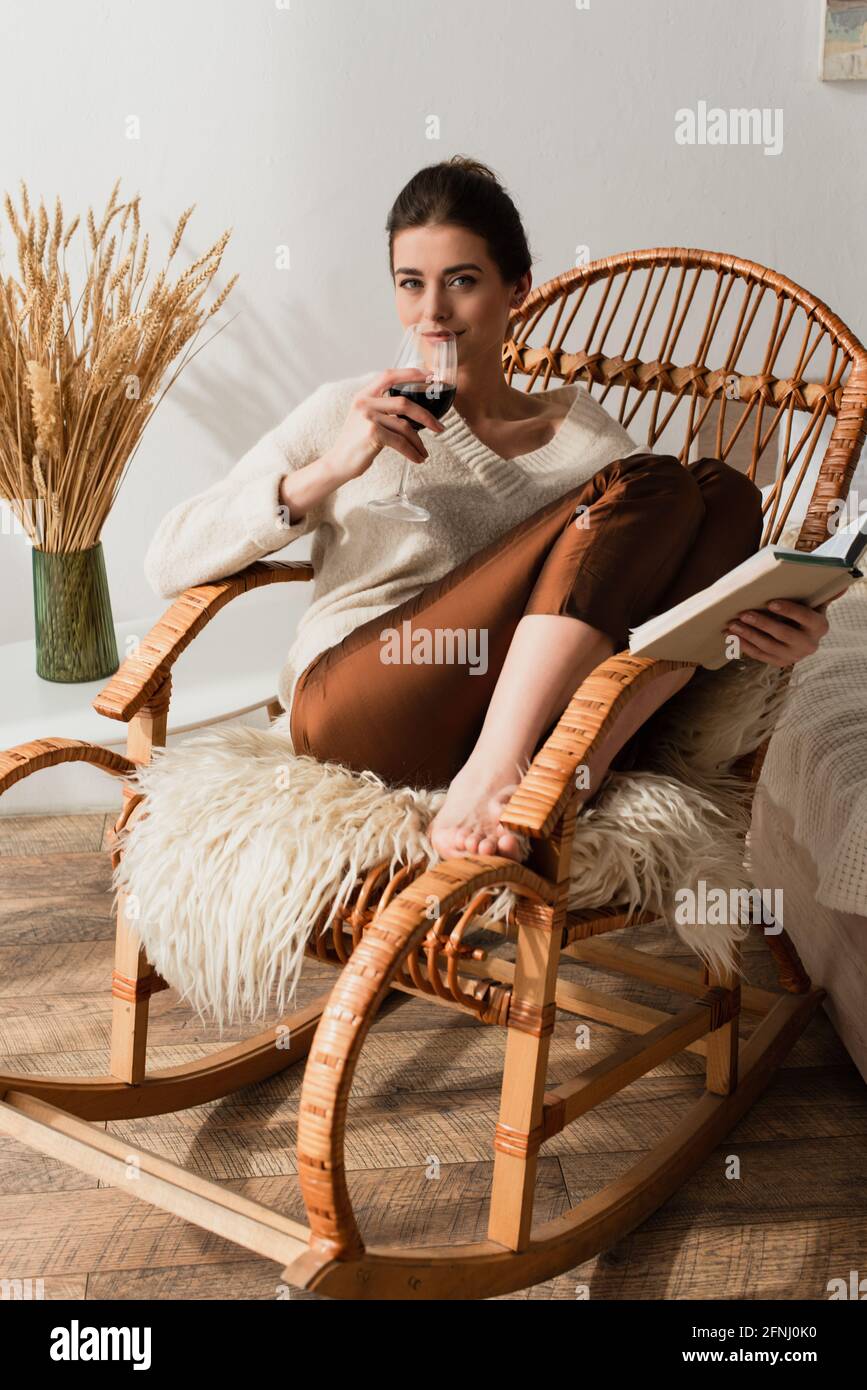 Woman in rocking chair drinking hi-res stock photography and images - Alamy