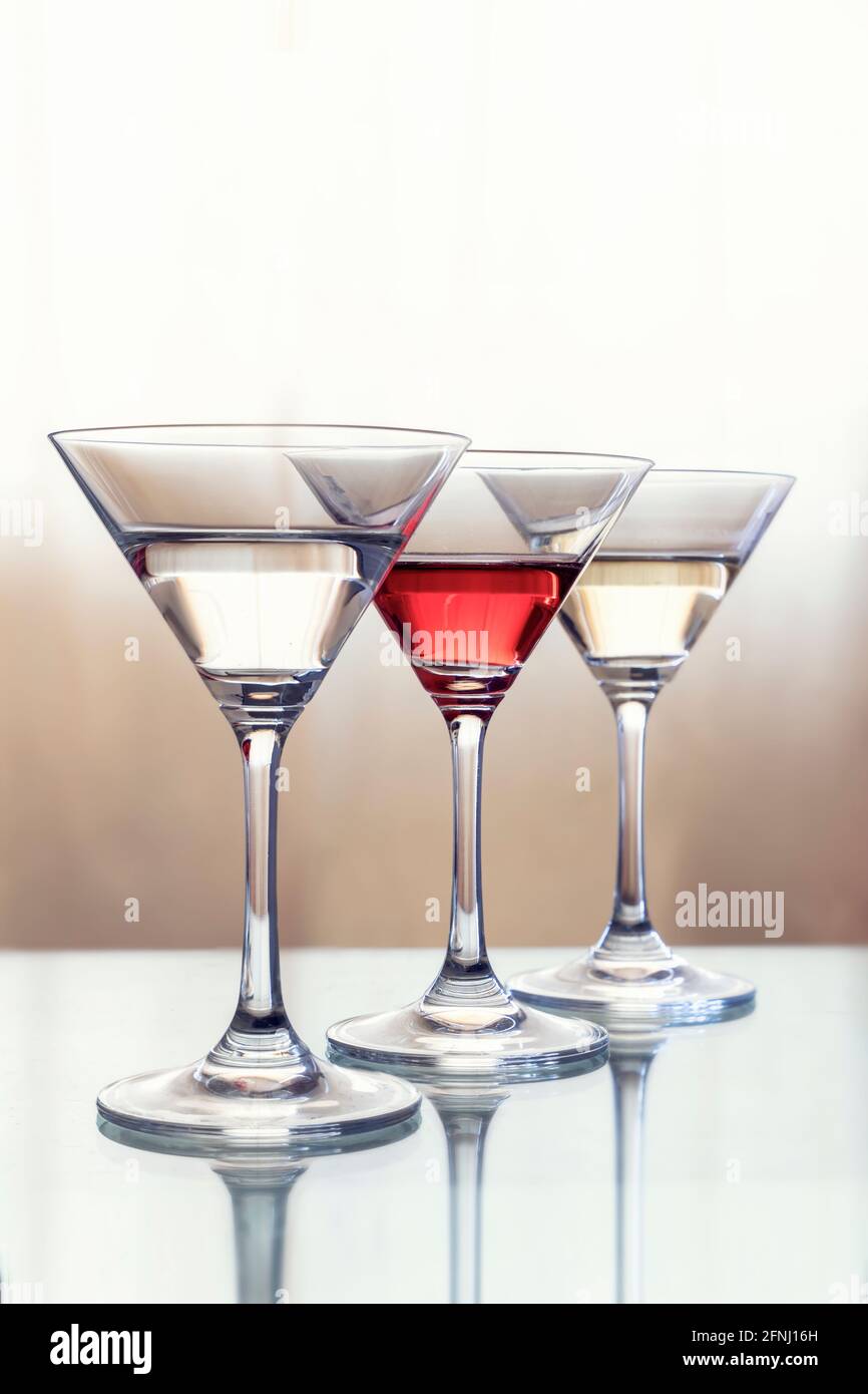 three cocktail glasses with beautiful triangular glasses. Concept for ...
