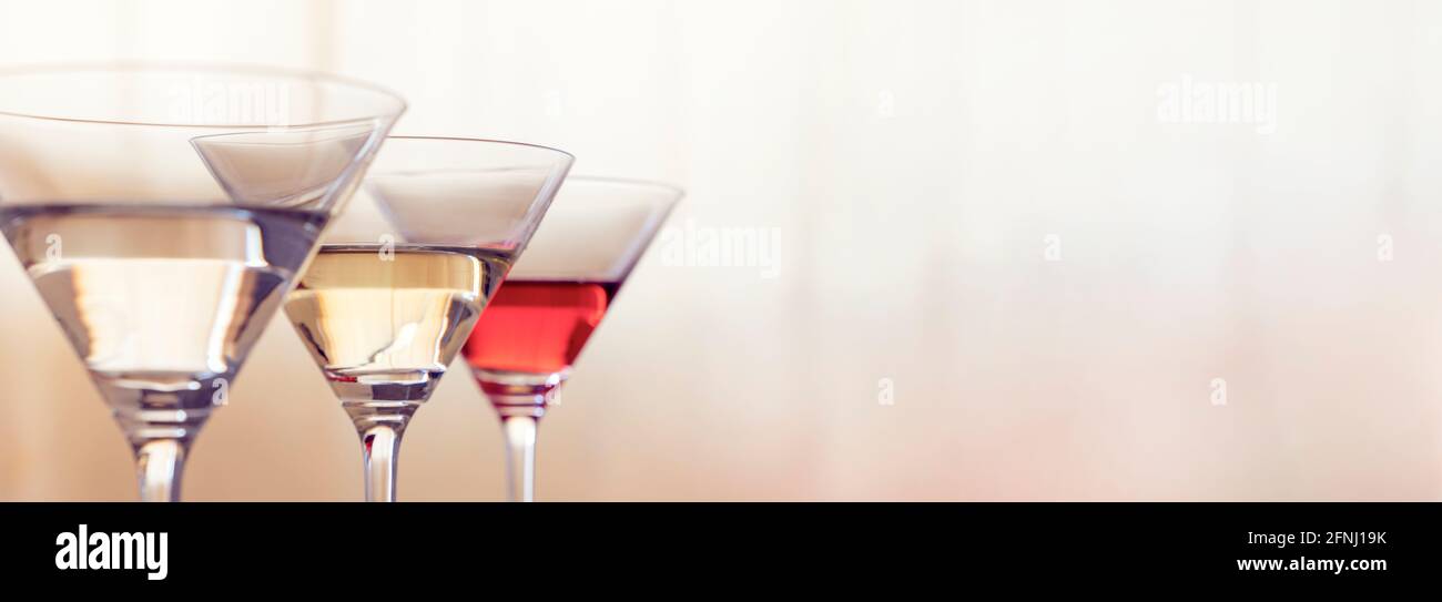 three cocktail glasses with beautiful triangular glasses. close-up ...