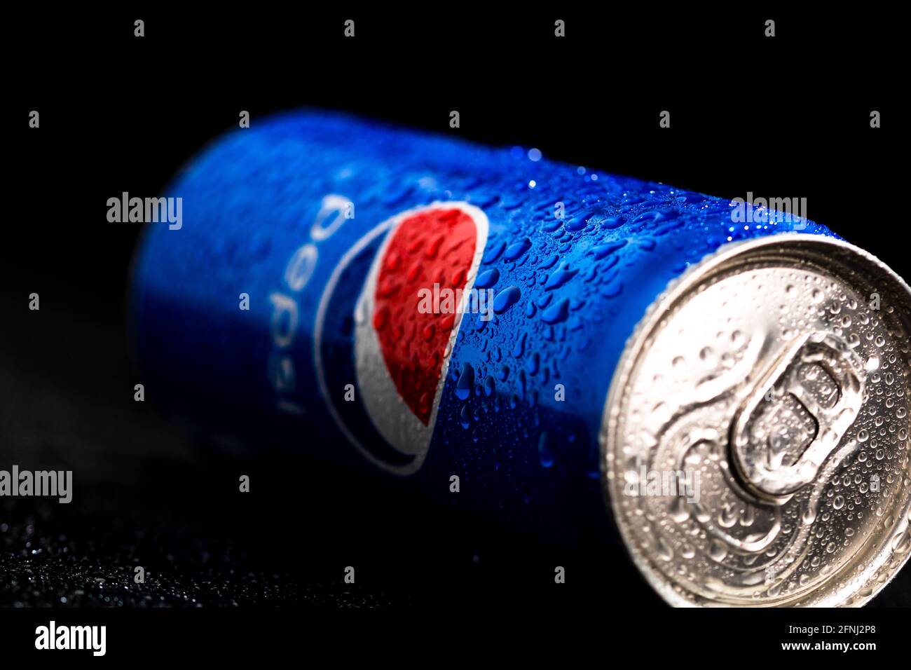 Editorial photo of Pepsi can with water droplets on black background ...