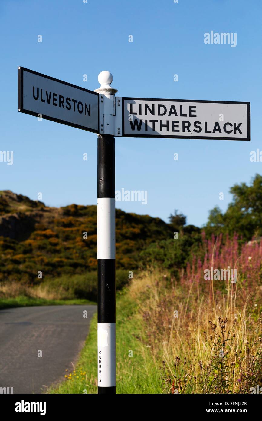 Road signs pointing to Ulverston, Lindale and Witherslack in Cumbria ...