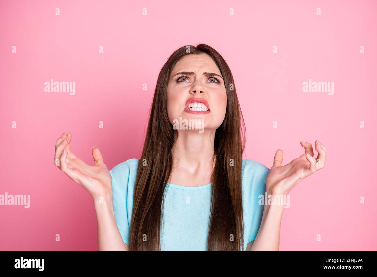 Crazy lady bad mood grinning teeth look up empty space wear t-shirt ...