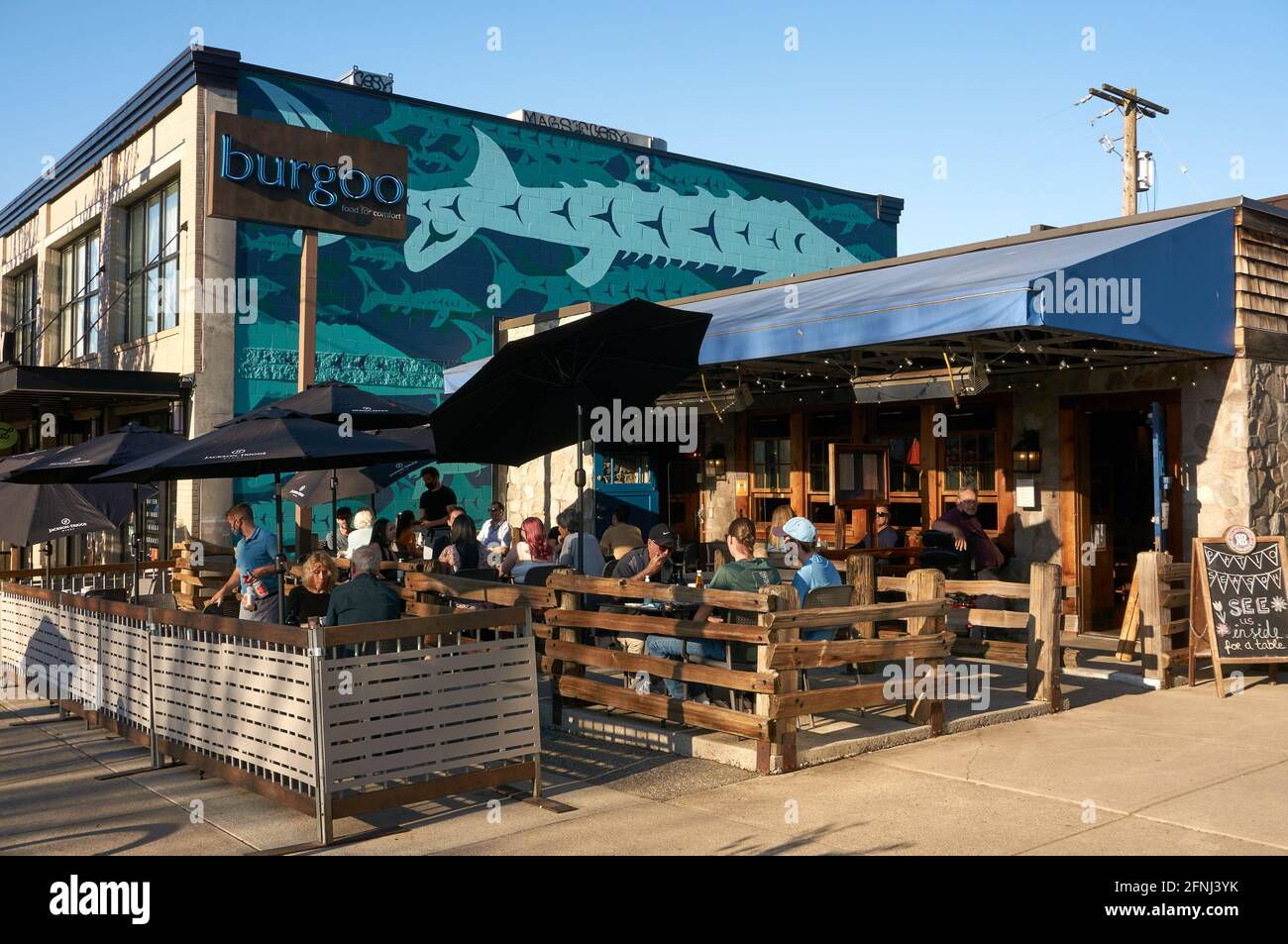 People dining outdoors at Burgoo restaurant on Main Street in Mount ...