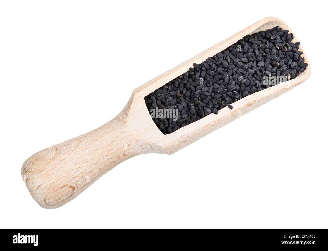 top view of Nigella sativa seeds (black caraway) in wood scoop cutout ...