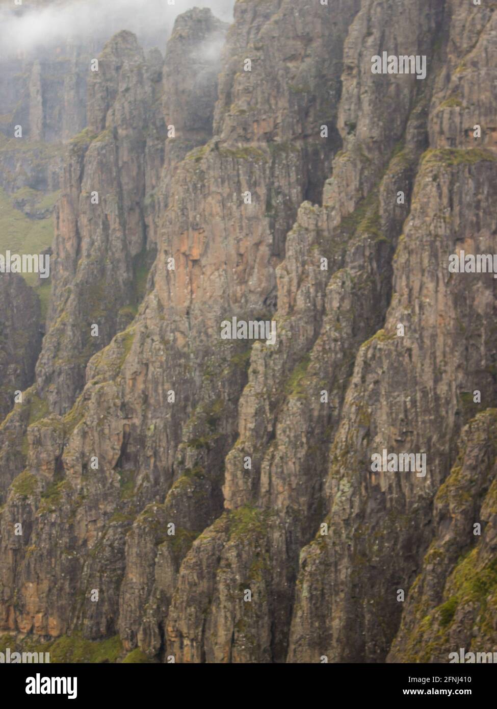 Close view of the steep jagged cliffs of the Drakensberg Mountains ...