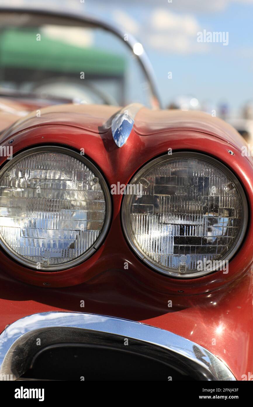 The twin headlight of a retro red car Stock Photo - Alamy