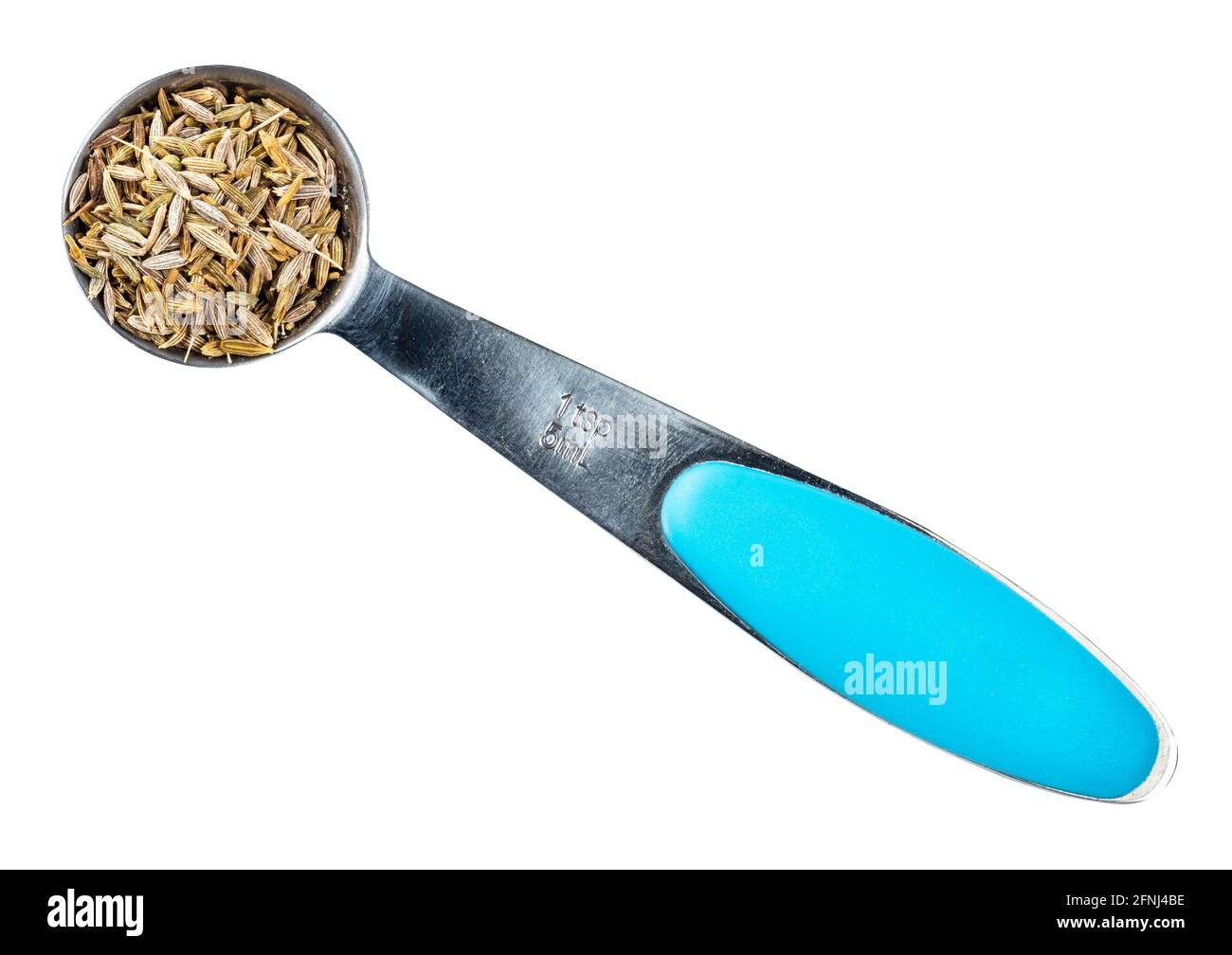 top view of cumin seeds in measuring teaspoon cutout on white ...