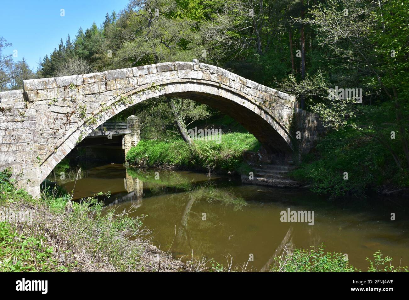 Medieval bridge known as beggar's bridge over the river esk Stock Photo ...